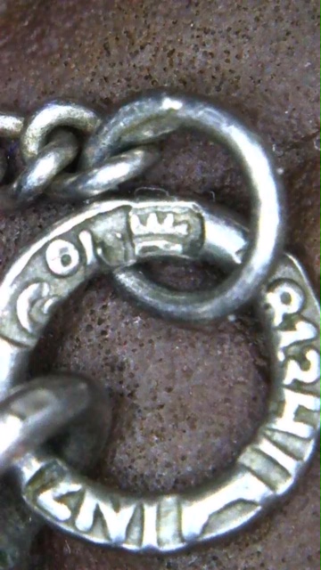 Odd stamps on silver chain | Antiques Board