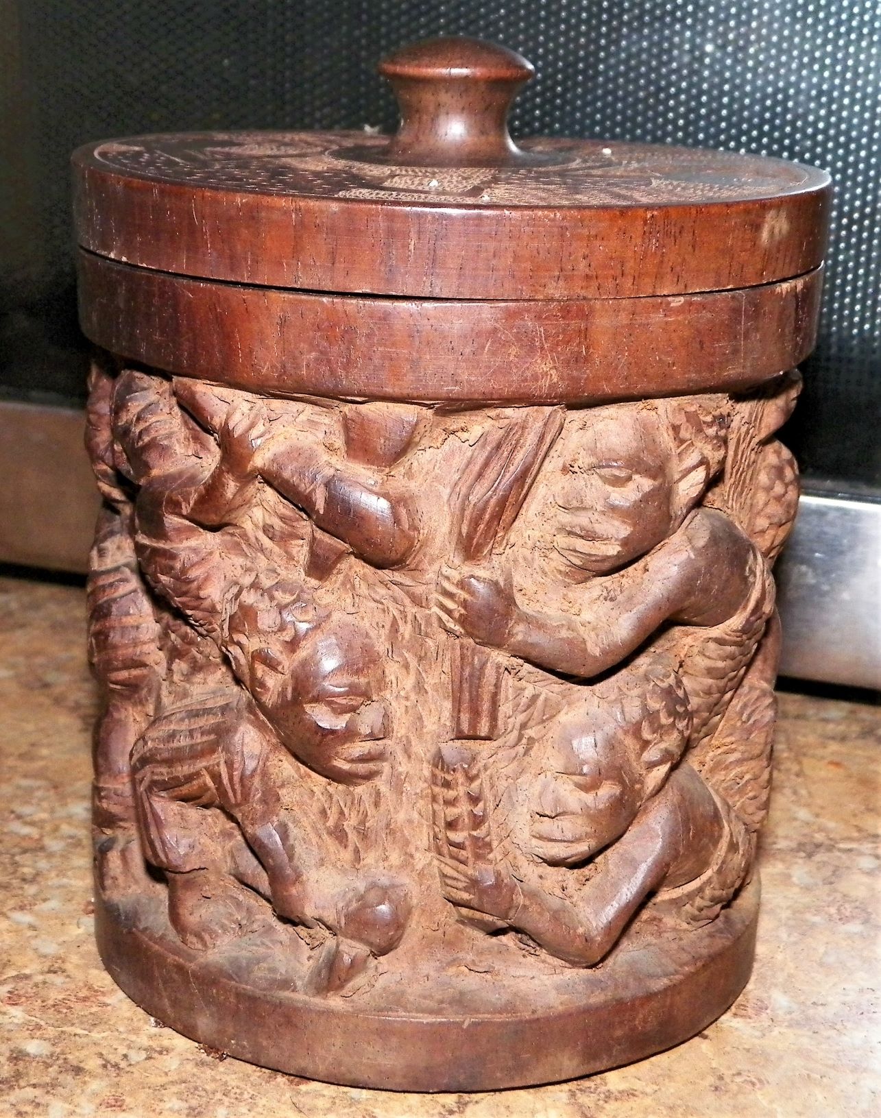 What is this carved in relief 3D wood jar w/African(?) figures ...