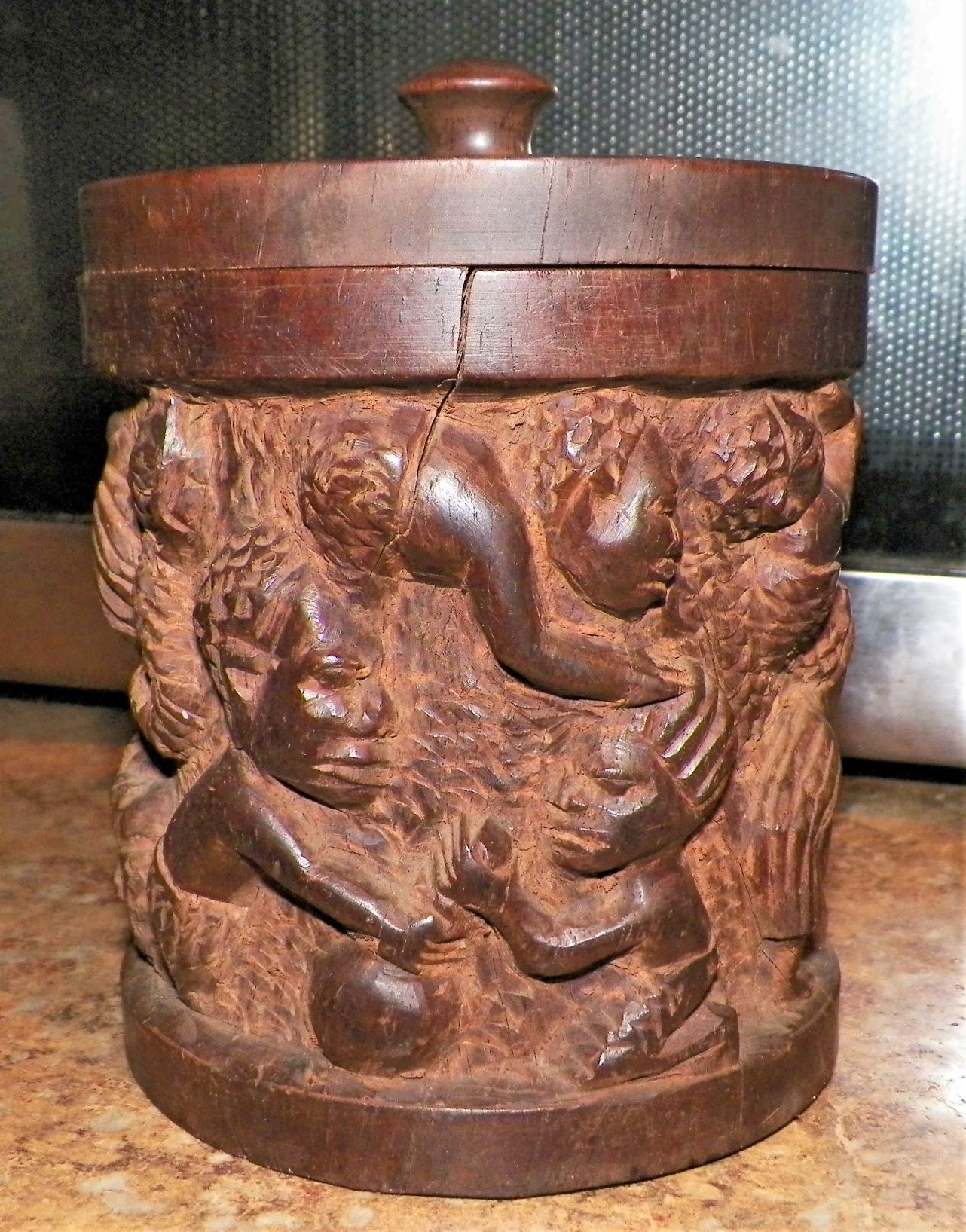 What is this carved in relief 3D wood jar w/African(?) figures ...