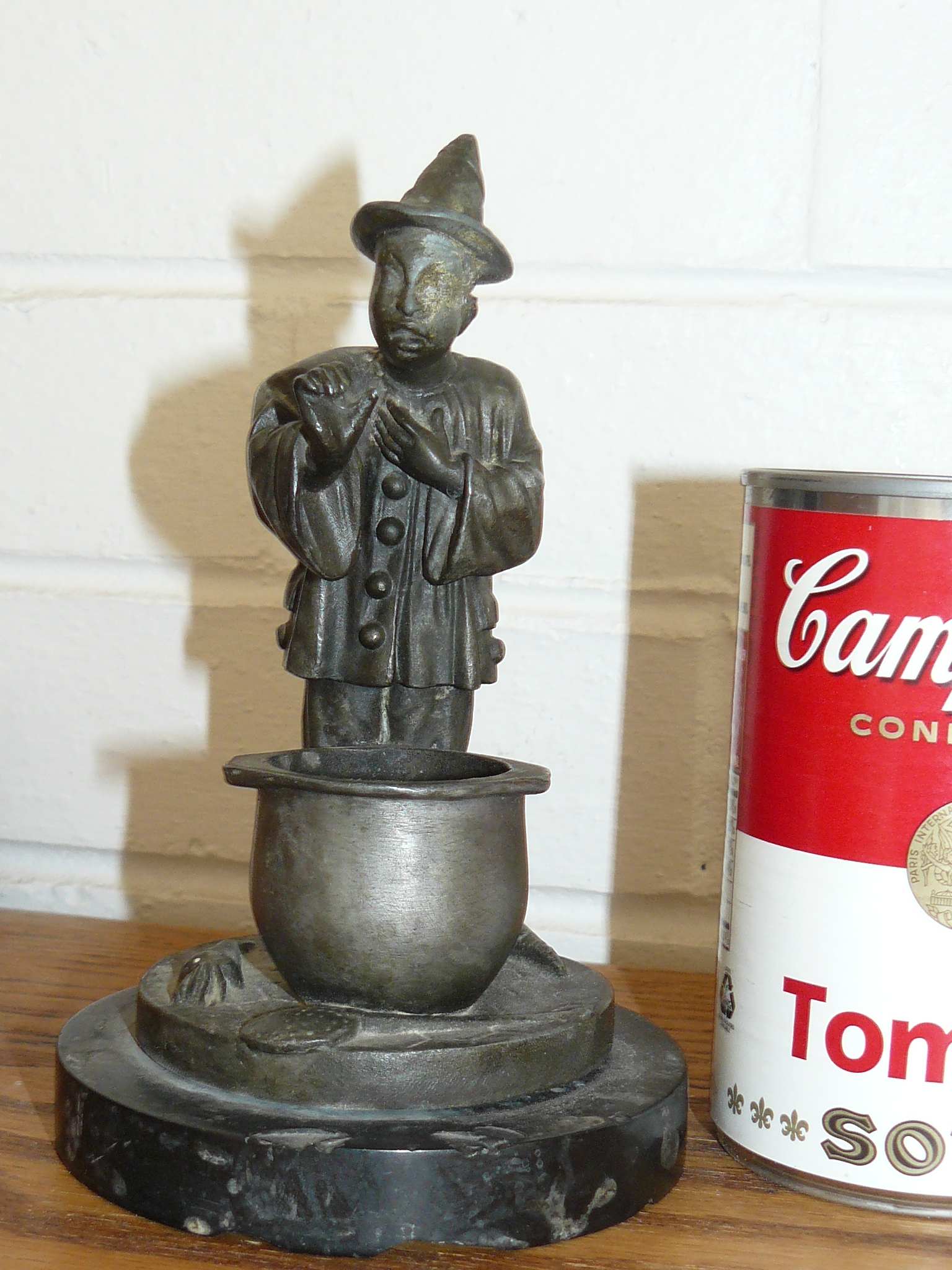 Antique Lead (?) figure 6" tall. Clown-like figure over cauldron ...