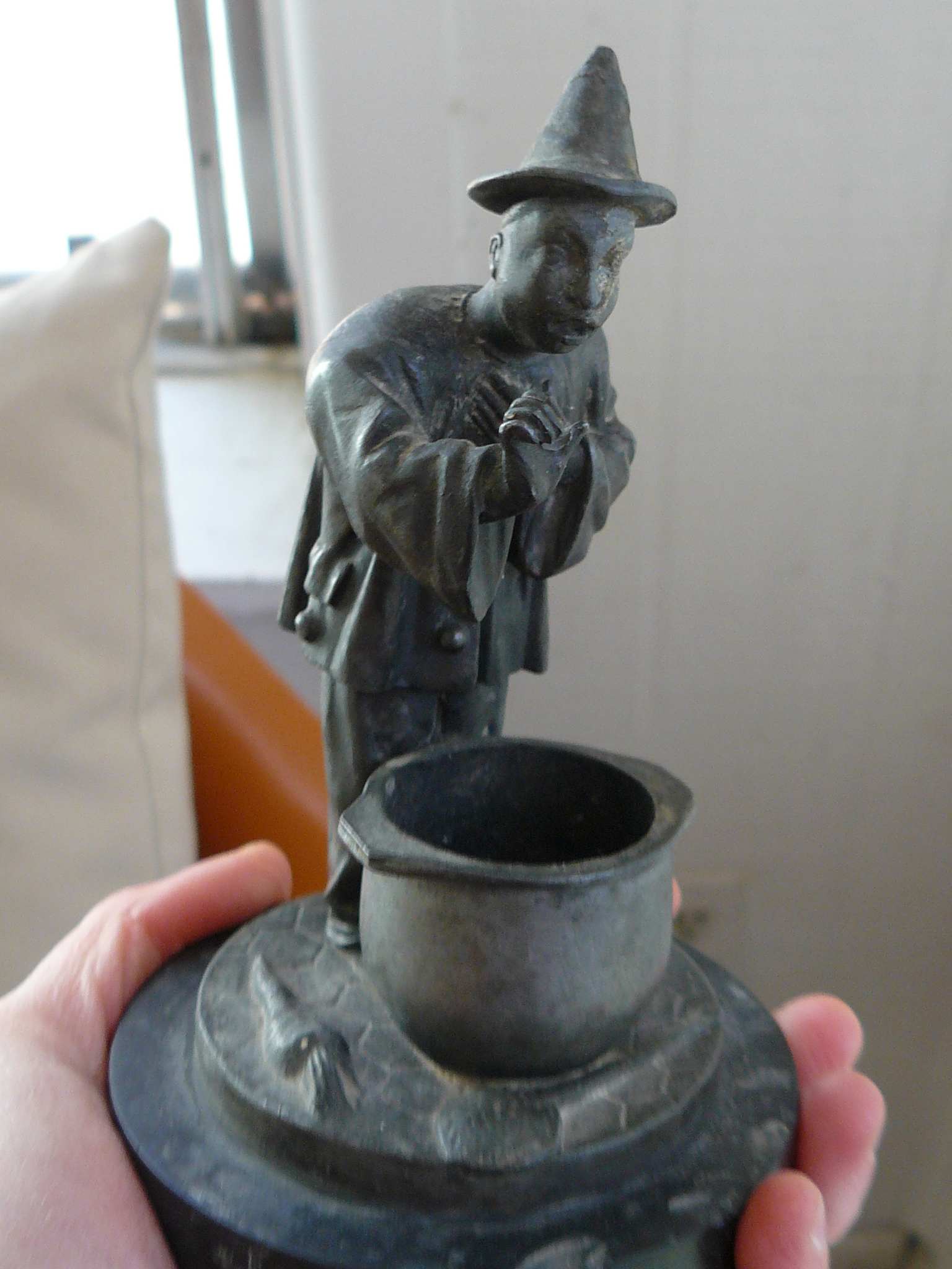 Antique Lead (?) figure 6" tall. Clown-like figure over cauldron ...